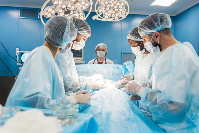 An International Team of Doctors Performs a Complex Surgical Operation ...