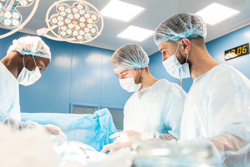 An International Team of Doctors Performs a Complex Surgical Operation ...