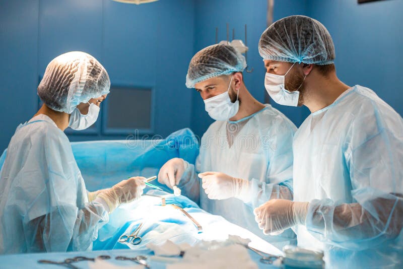 An International Team of Doctors Performs a Complex Surgical Operation ...