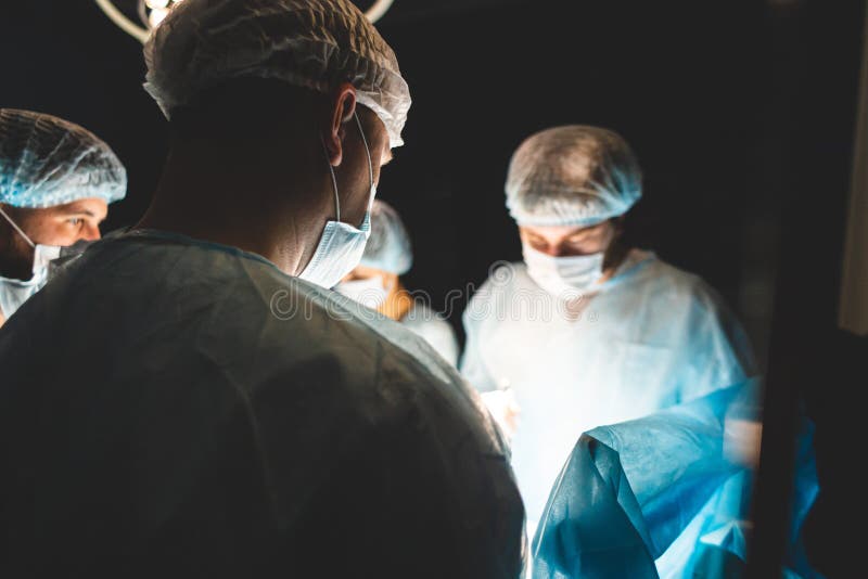 An International Team of Doctors Performs a Complex Surgical Operation ...