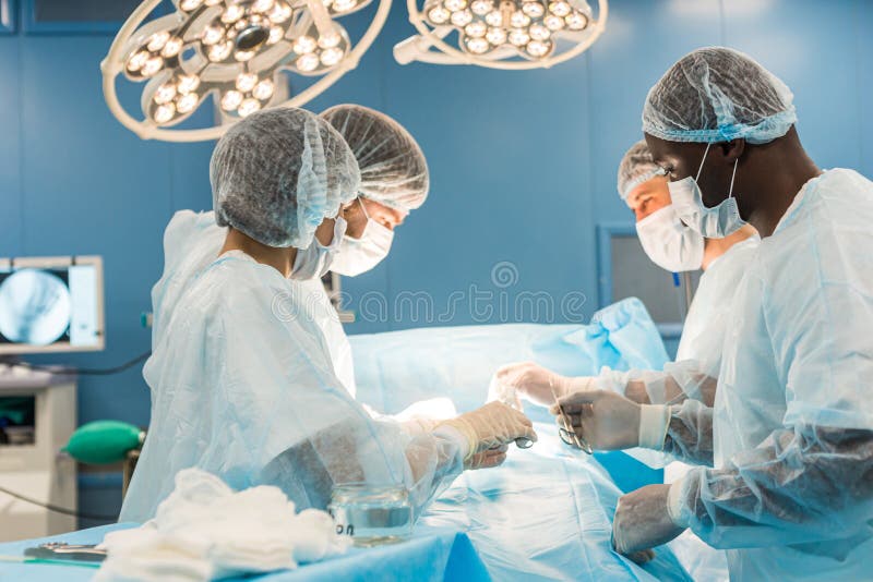 An International Team of Doctors Performs a Complex Surgical Operation ...