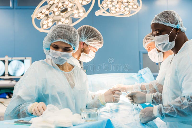 An International Team of Doctors Performs a Complex Surgical Operation ...