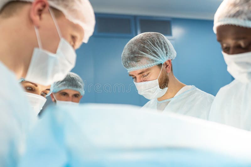 An International Team of Doctors Performs a Complex Surgical Operation ...