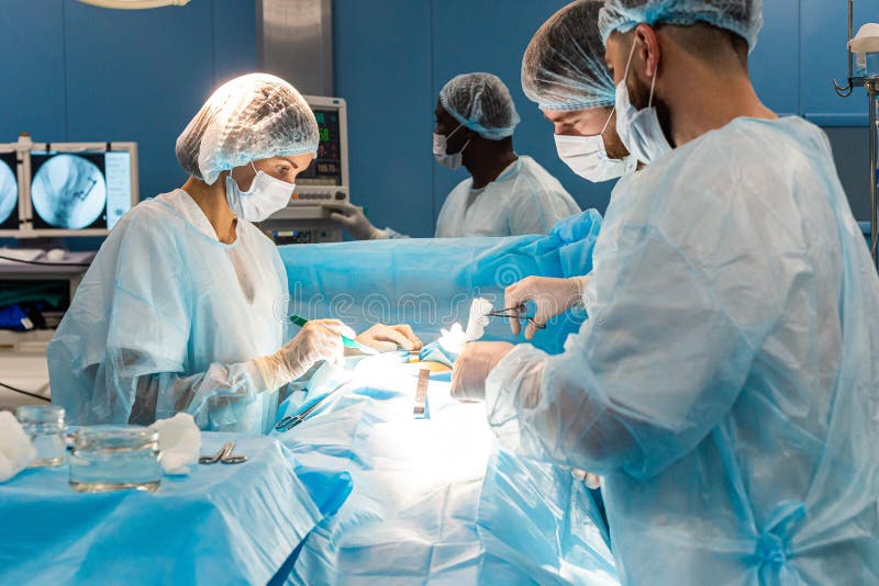 An International Team of Doctors Performs a Complex Surgical Operation ...
