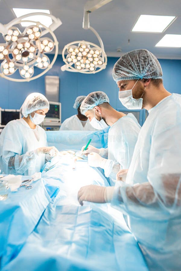 An International Team of Doctors Performs a Complex Surgical Operation ...