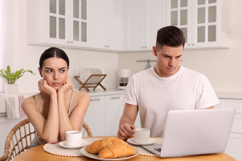 Internet Addiction. Man with Laptop Ignoring His Girlfriend in Kitchen ...