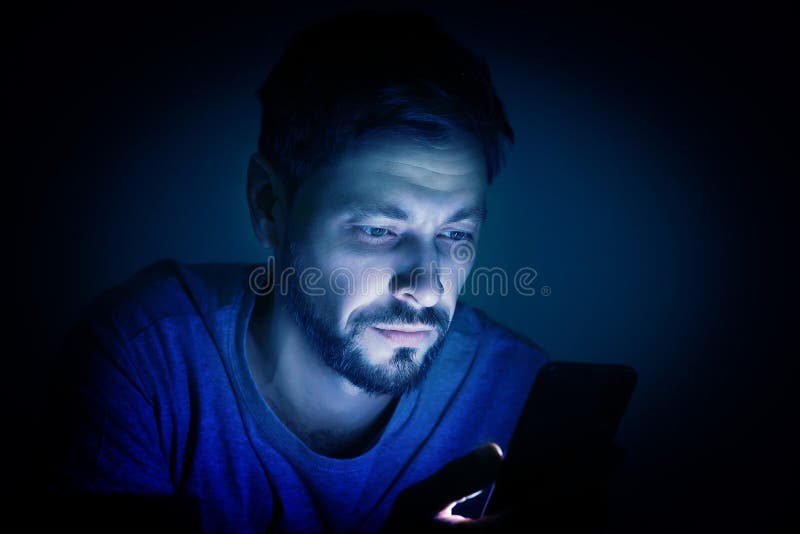 Internet Addiction. Man Using Smartphone at Night. Toned in Blue Stock ...