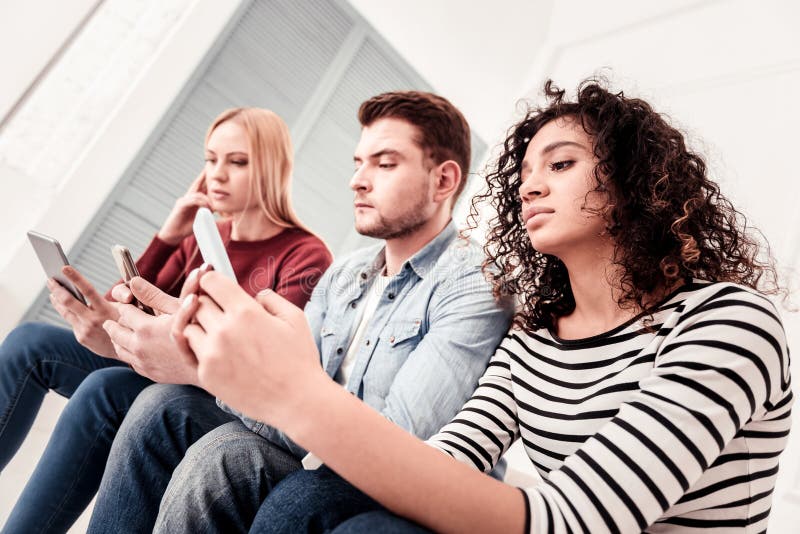 Nice Young People Using Their Gadgets Stock Image - Image of innovation ...