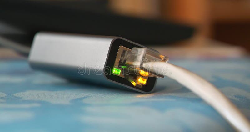 Internet Cable through an Adapter Connected To Laptop. Ethernet Cable ...