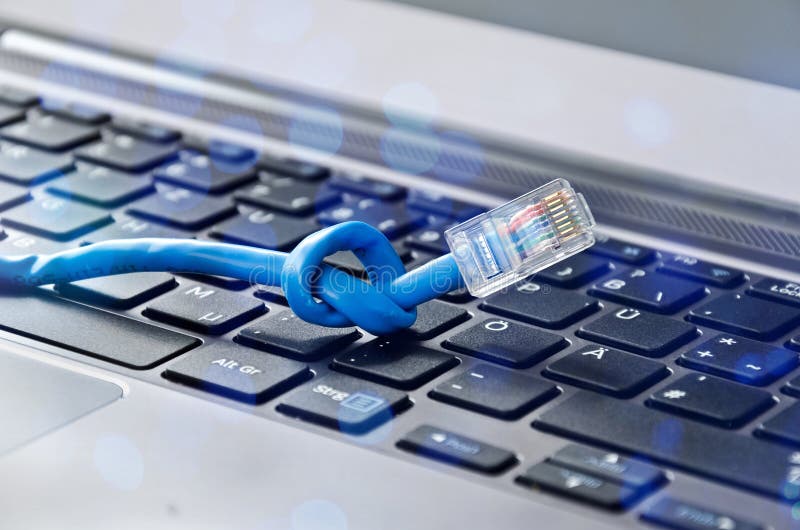 Internet Cable Tied into Knot Lying on Computer Keyboard Symbolizing ...