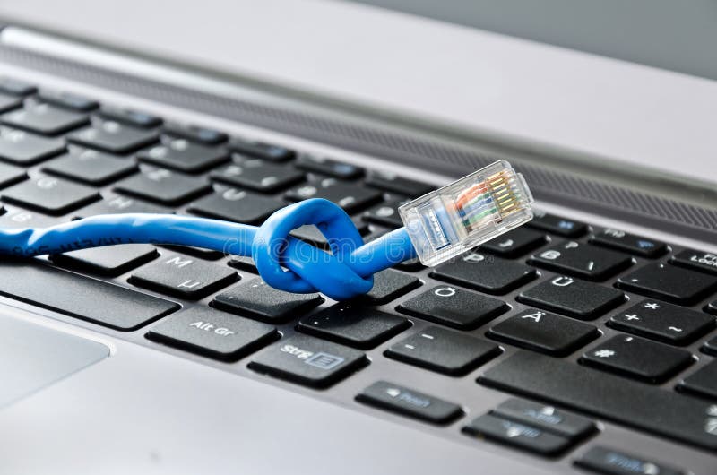 Internet Cable Tied into Knot Lying on Computer Keyboard Symbolizing ...