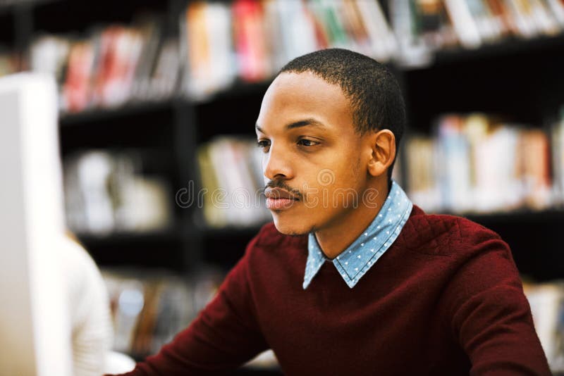 The Internet is Full of Information. a Focused Young Man Working on a ...