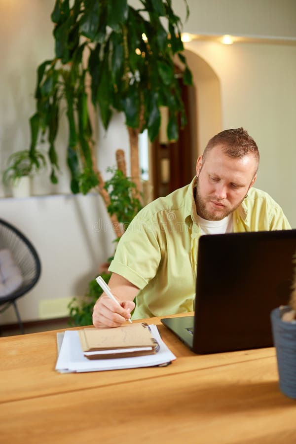 Internet for Learning and Job Search. Man Hand Making Notes in Notepad ...