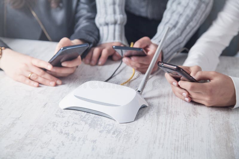 Internet Router, Laptop, Tablet, Smartphones on the Desk. Hands Using ...