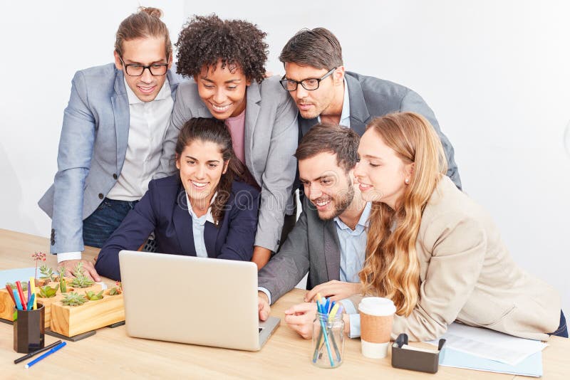 Internet Start-up Team Looks Together on Laptop Stock Image - Image of ...