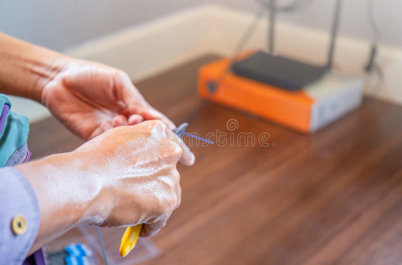 Internet Technician Man are Cutting and Installation Fiber Optic Cables ...