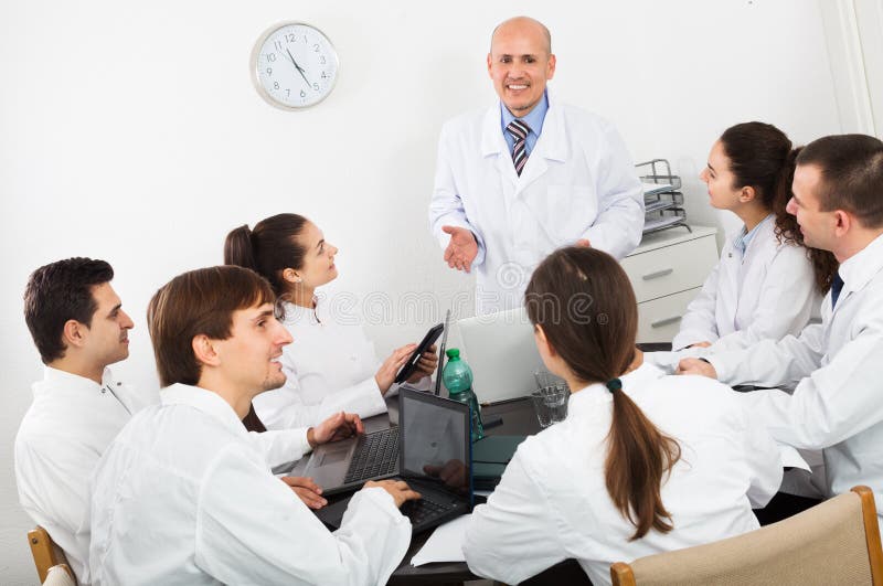 Interns and Professor at Hospital Meeting Stock Image - Image of ...