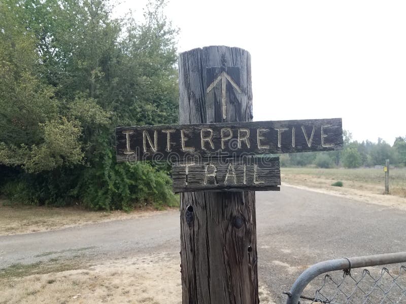 Interpretive Trail Sign with Arrow on Wood Post Stock Photo - Image of ...