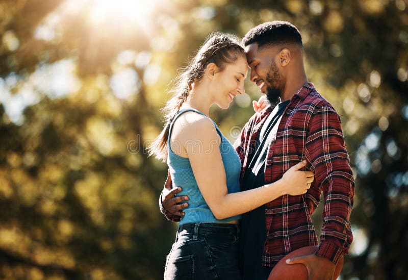 Interracial Couple Outdoor Park And Love With A Hug For Commitment