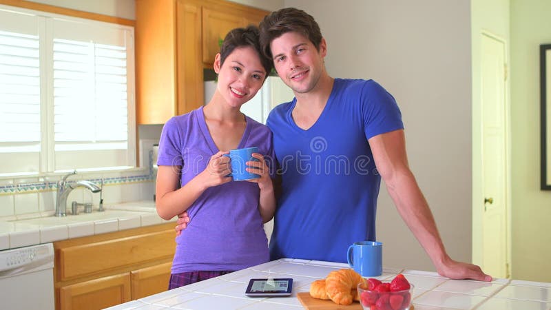 Interracial Couple Smiling in Kitchen Stock Footage - Video of ...