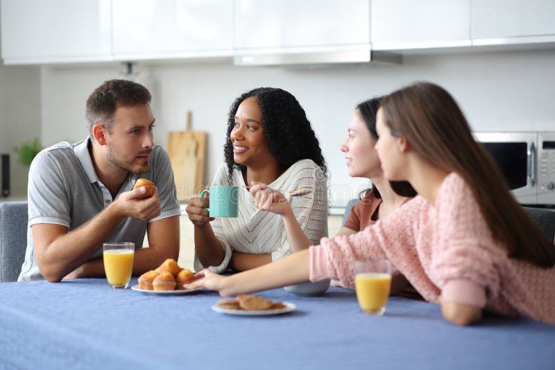 Interracial Group of Friends Talking in a Kitchen Stock Photo - Image ...