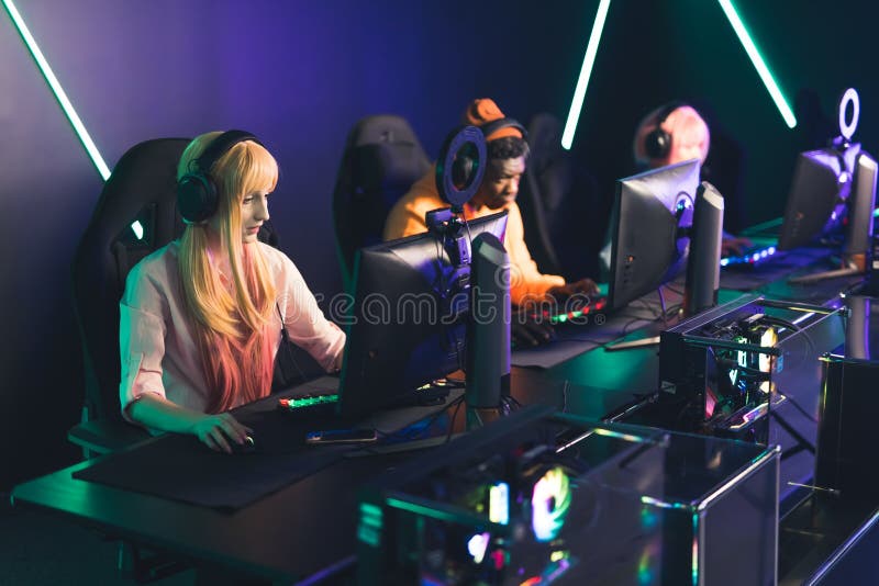 Interracial Team Playing Esports Games on Computers Using Professional ...