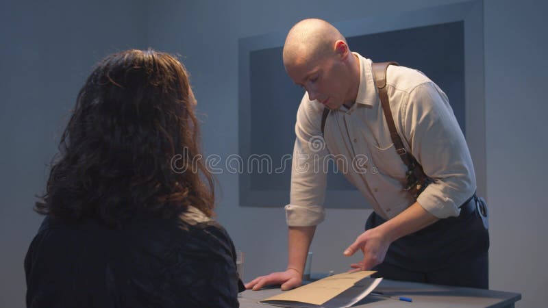 Interrogation of the Suspect. Serious Cop. Sliding Stock Image - Image ...