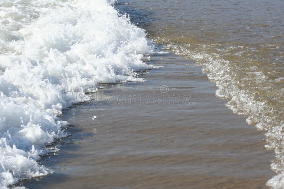 Intersecting waves stock image. Image of sand, waves - 64836887
