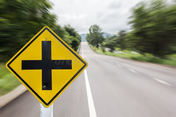 Intersection Ahead Sign on Blur Road Background Stock Image - Image of ...