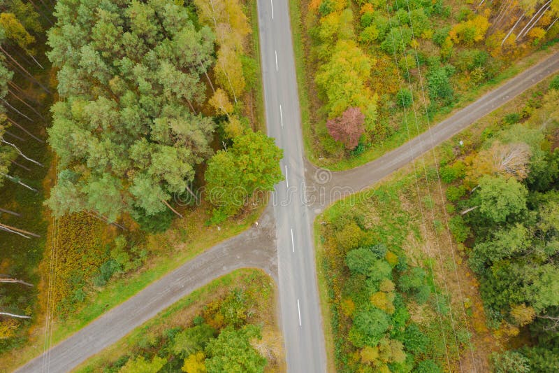 The Intersection of an Asphalt Road with a Forest Road. View from the ...