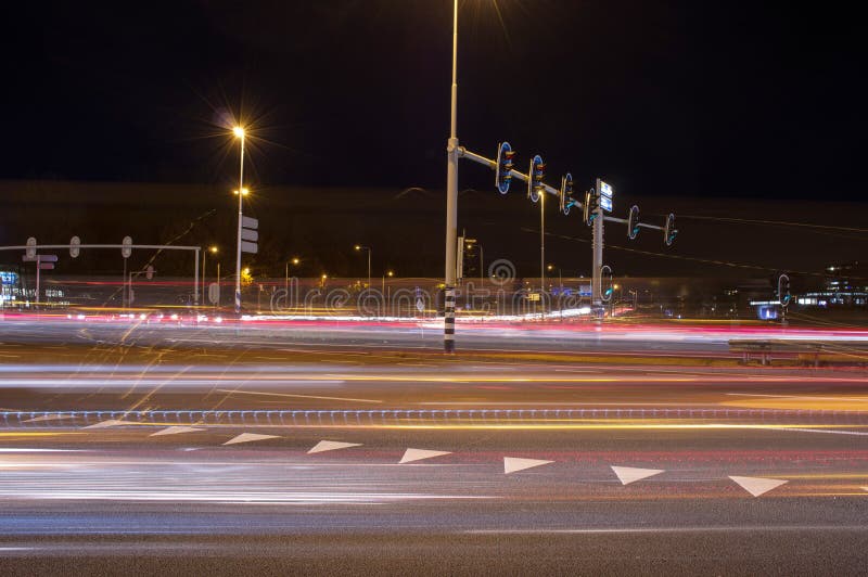 Intersection with a Row Cars at Night, Netherlands Stock Image - Image ...