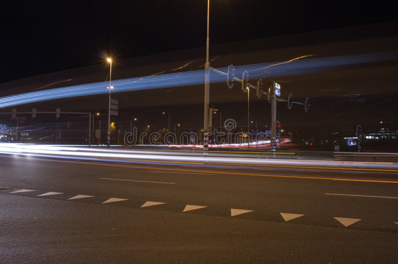 Intersection with a Row Cars at Night, Netherlands Stock Image - Image ...