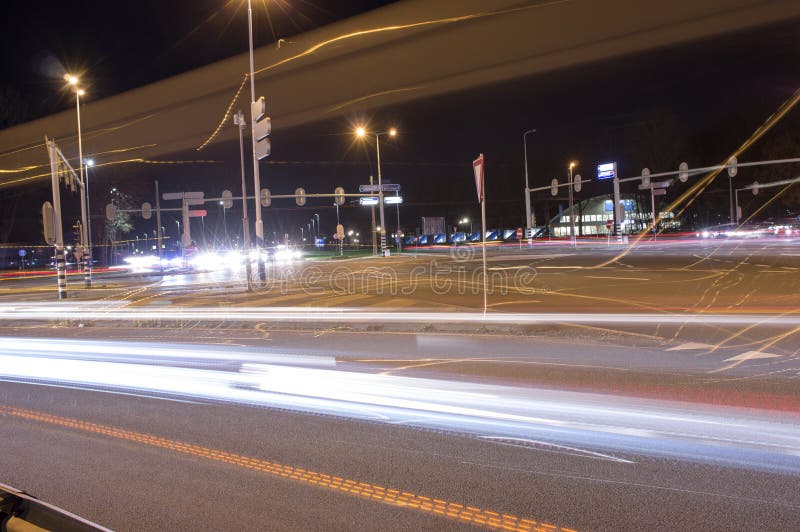 Intersection with a Row Cars at Night, Netherlands Stock Image - Image ...
