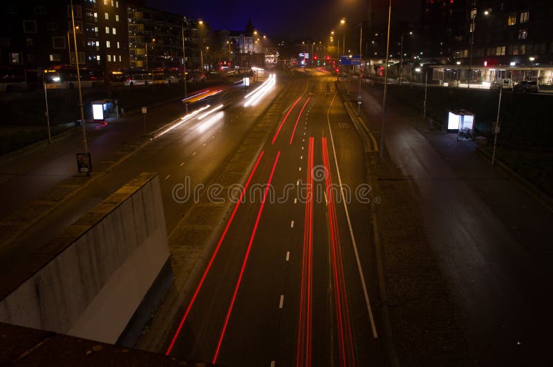 Intersection with a Row Cars at Night, Netherlands Stock Image - Image ...