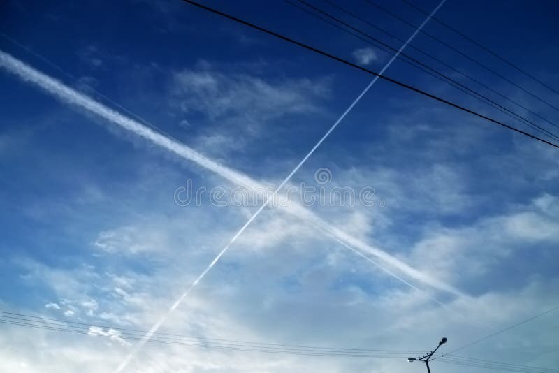 The Intersection of Traces from the Plane in the Blue Sky Stock Image ...