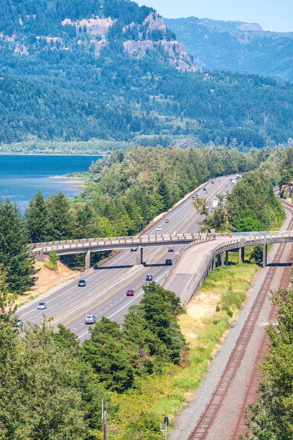 Interstate Traffic Along the Lake between Mountains Stock Image - Image ...