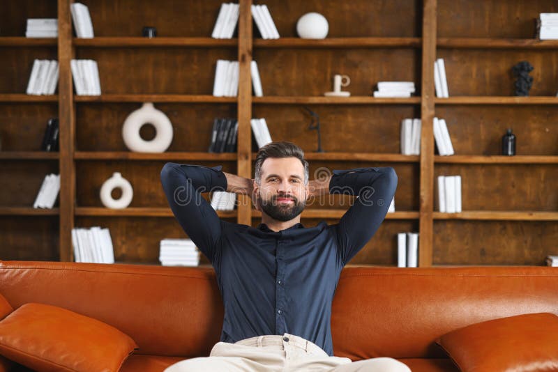 At an Interview. Man Sitting on the Leather Sofa and Smiling, while ...
