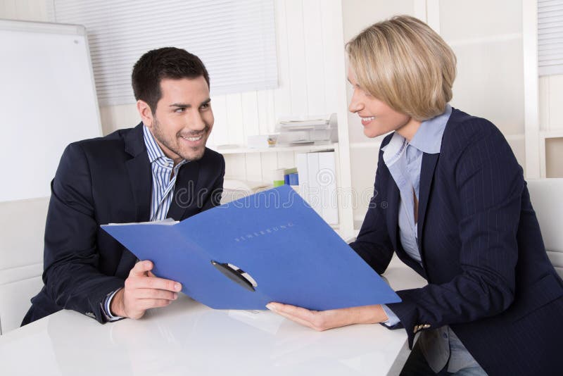 Interview with Manager and Young Attractive Man at Office. Stock Photo ...