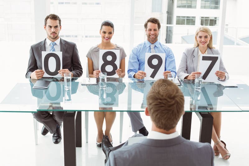 Interview Panel Holding Score Cards in Office Stock Photo - Image of ...
