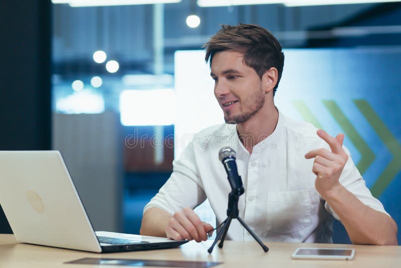 Interview Recording. Young Handsome Man Sitting at a Table in Front of ...