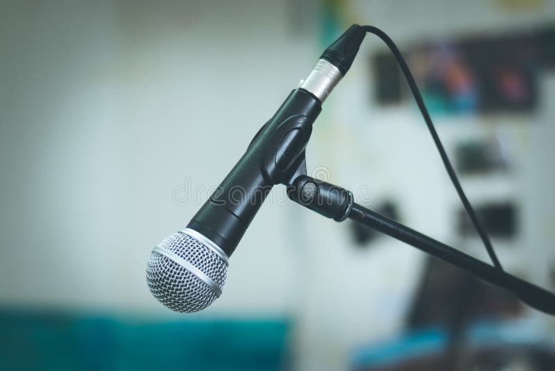 Interview Situation: Black Microphone on Tripod, Blurry Background ...