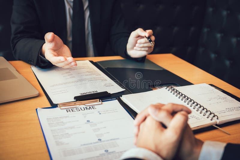 Interviewer is Sitting To Explain about the Work of the New Employee ...