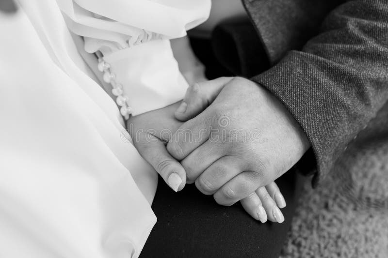 Intimate Moment of Connection: Two Hands Intertwined in Gesture of ...