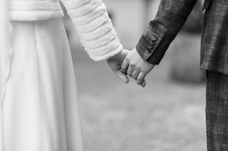 Intimate Moment between a Couple Holding Hands in Black and White Stock ...