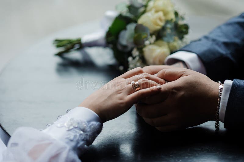 Intimate Wedding Moment with Hands and Bouquet Stock Image - Image of grace, bouquet: 351285887