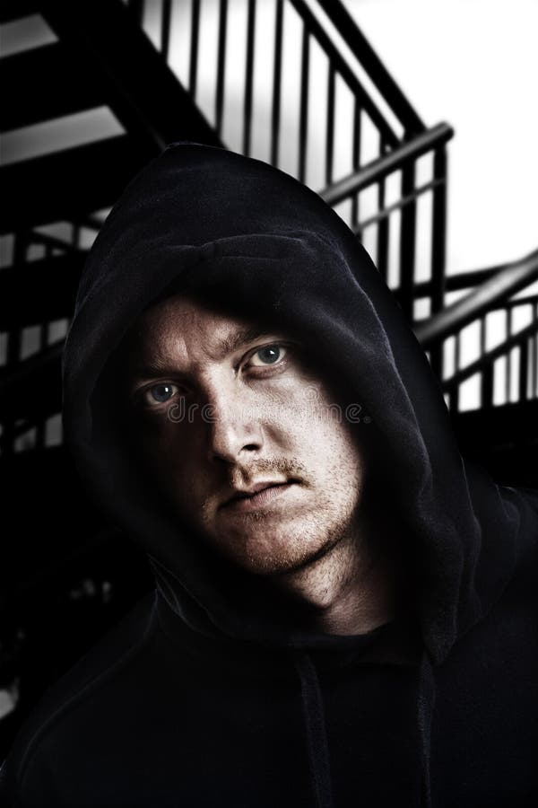 Intimidating Hooded Male stock image. Image of staircase - 6496989