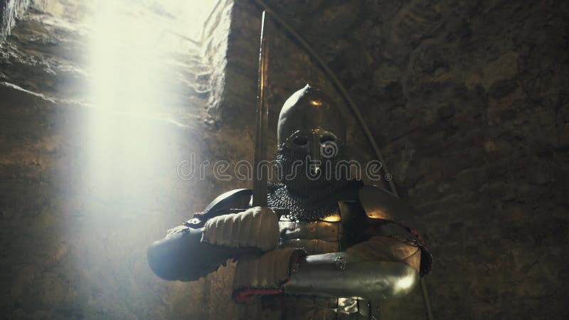 Intimidating Warrior in Armor Holding Sword Stock Photo - Image of ...