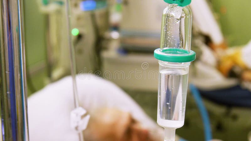 Intravenous Drip in ICU with Patient on Background Stock Footage ...