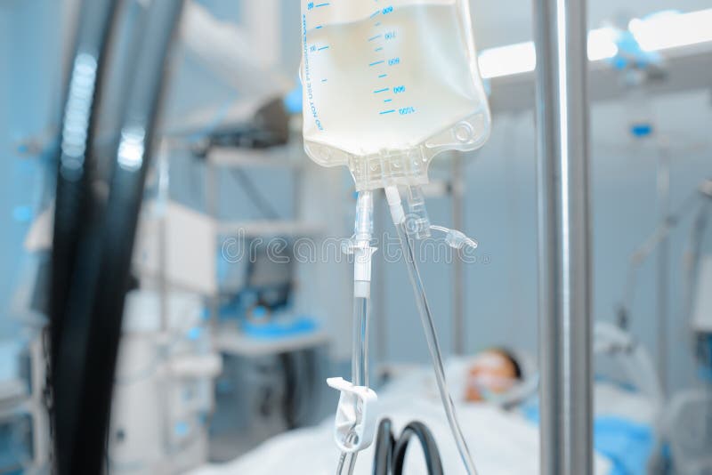 Intravenous System Dripping To the Patient in ICU Stock Image - Image ...