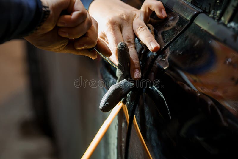 Intricate Car Theft Scene with Tools and Hands in Action Stock Image ...